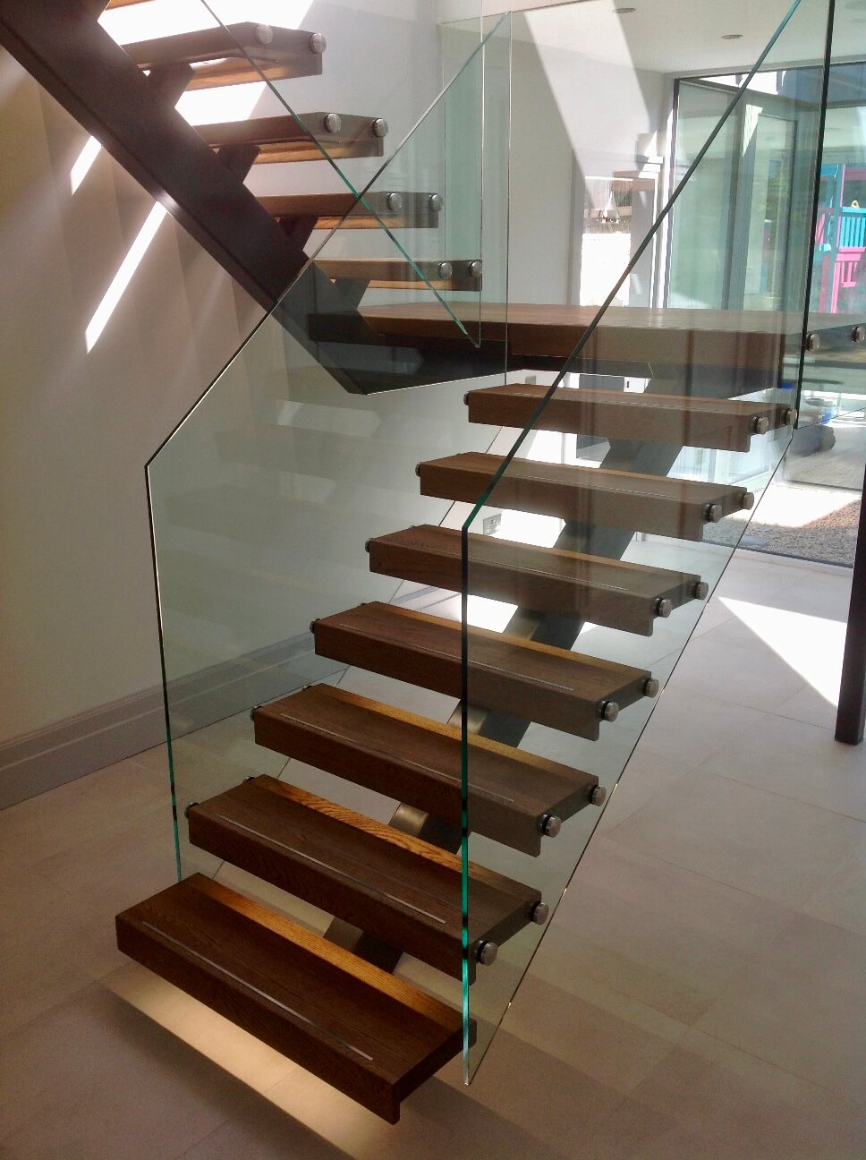 Grey Steel Spine Stairs with Glass Balustrade - Staircase Design and ...