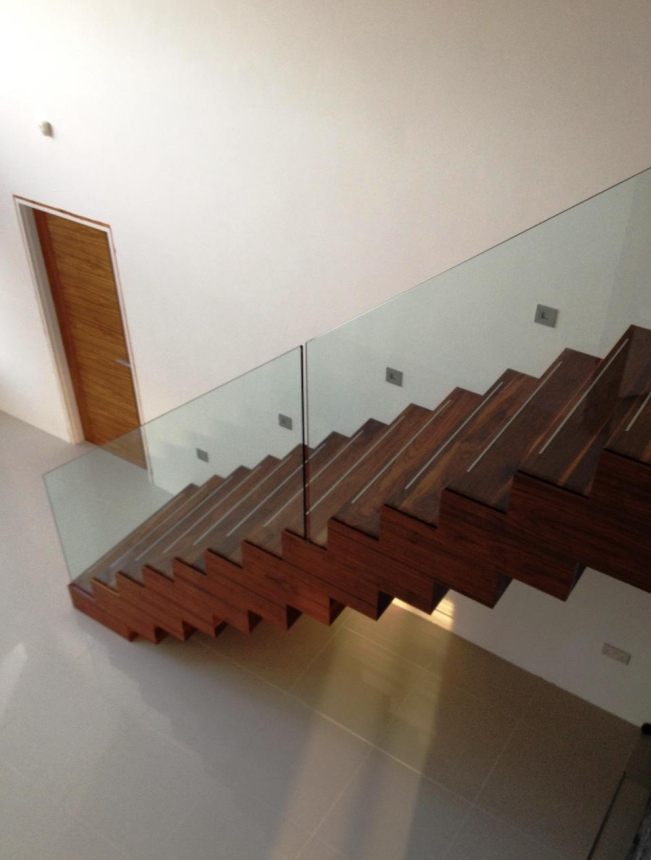 Concrete staircase with stepped soffit